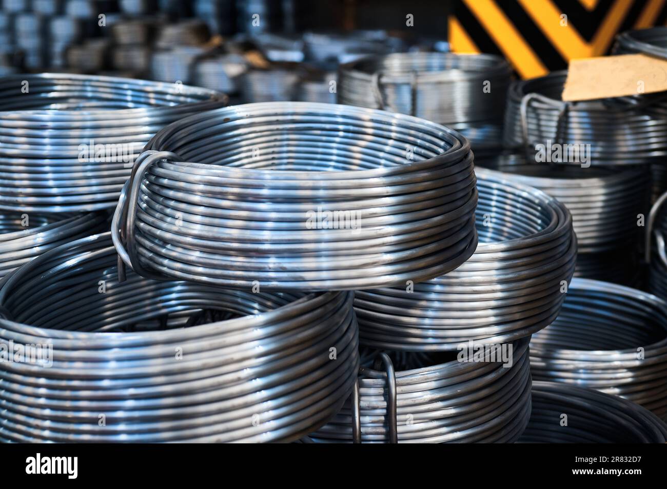 Coils of grey lead rod for bullets production at plant Stock Photo - Alamy