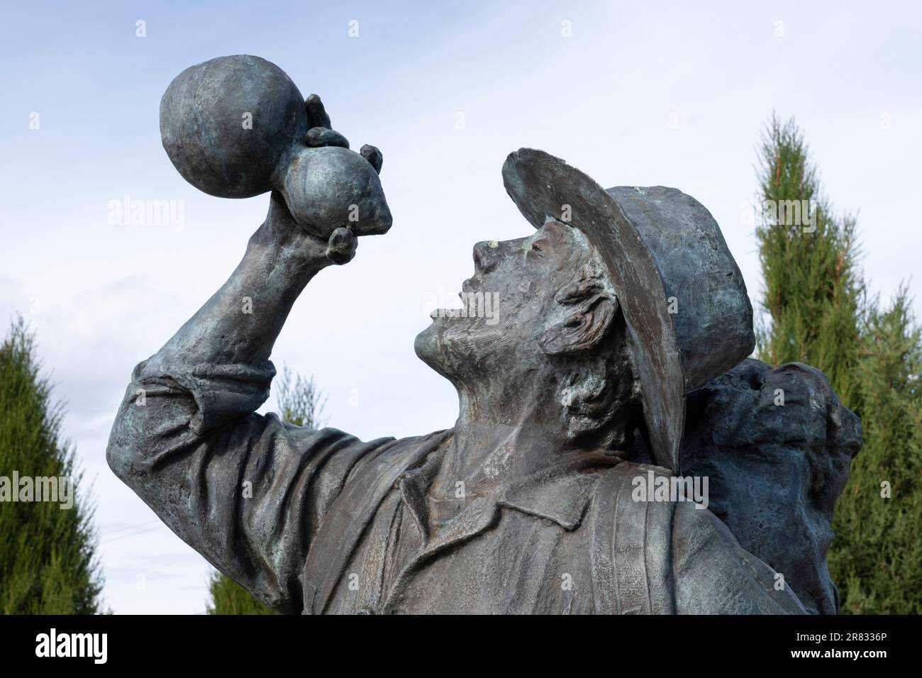 Statue of a pilgrim drinking from a gourd along the Camino Frances in ...