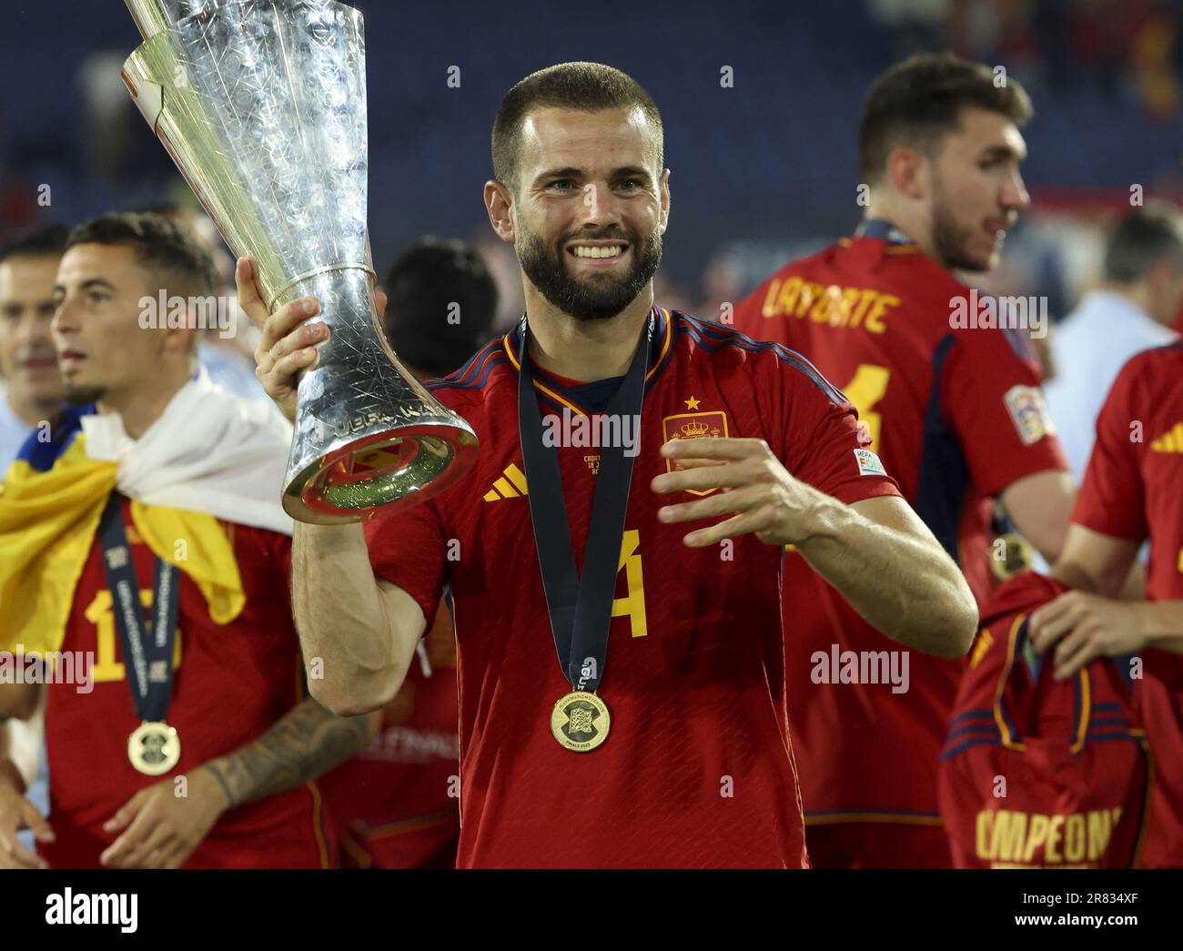 Nacho of Spain celebrates the victory with the trophy following the ...