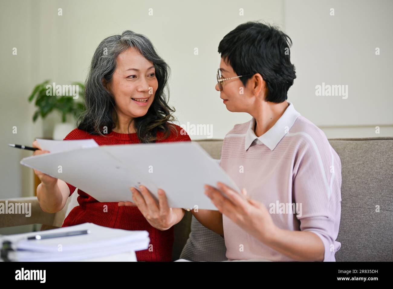 A beautiful and professional middle-aged Asian female health insurance ...