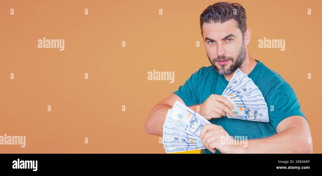 Successful man counting money. Handsome middle age man holding bunch of ...