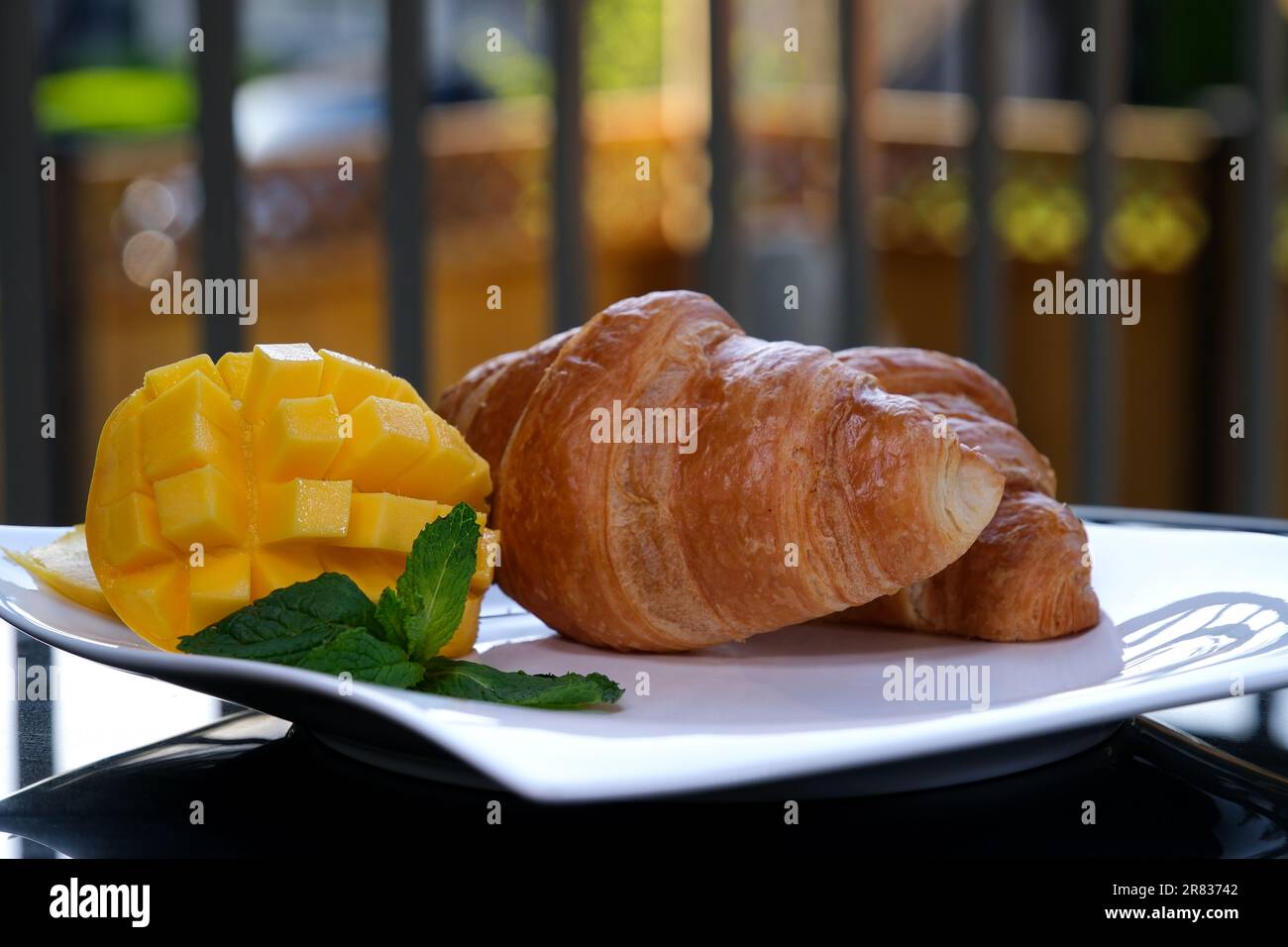 delicious croissant with fruits on a white plate serving cleanliness ...