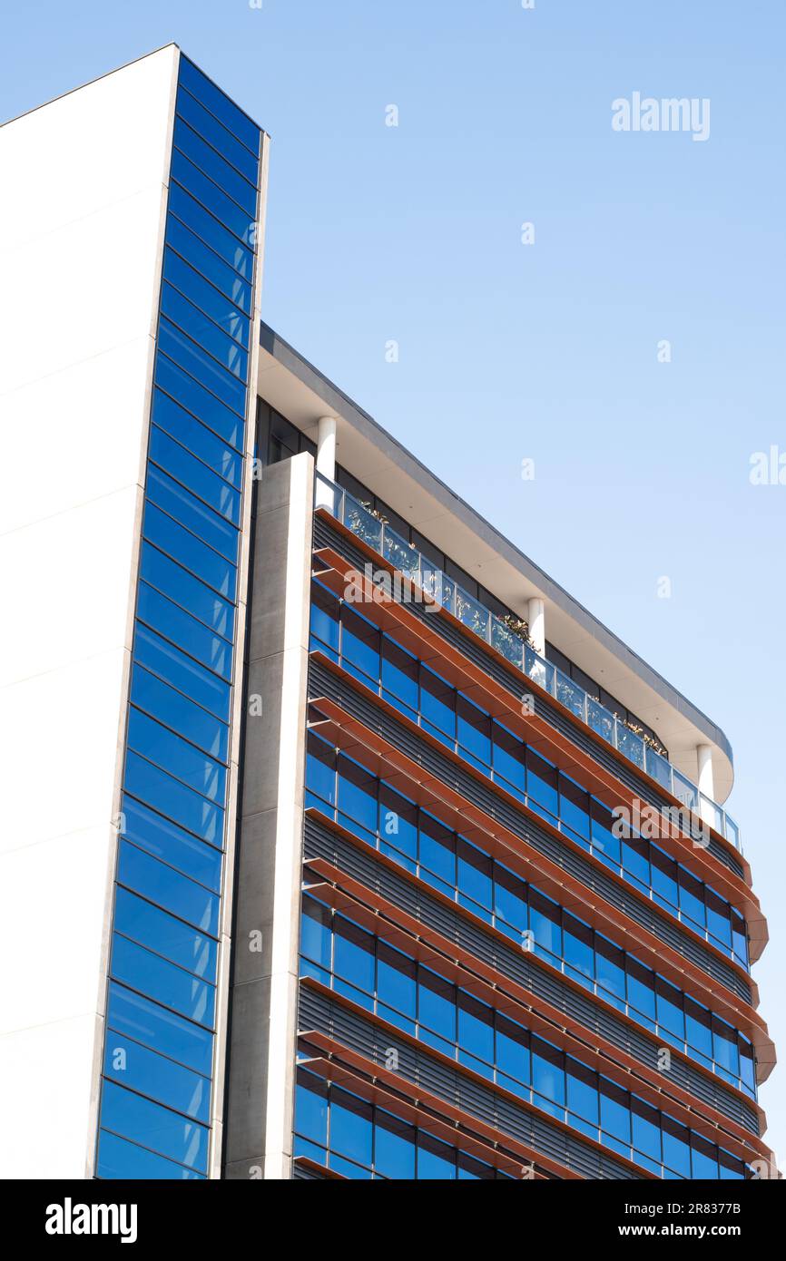 A high-rise building comprising a mix of design elements including ...