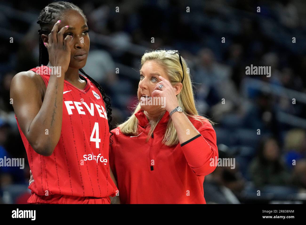 Indiana Fever head coach Christie Sides coaches Queen Egbo during a ...
