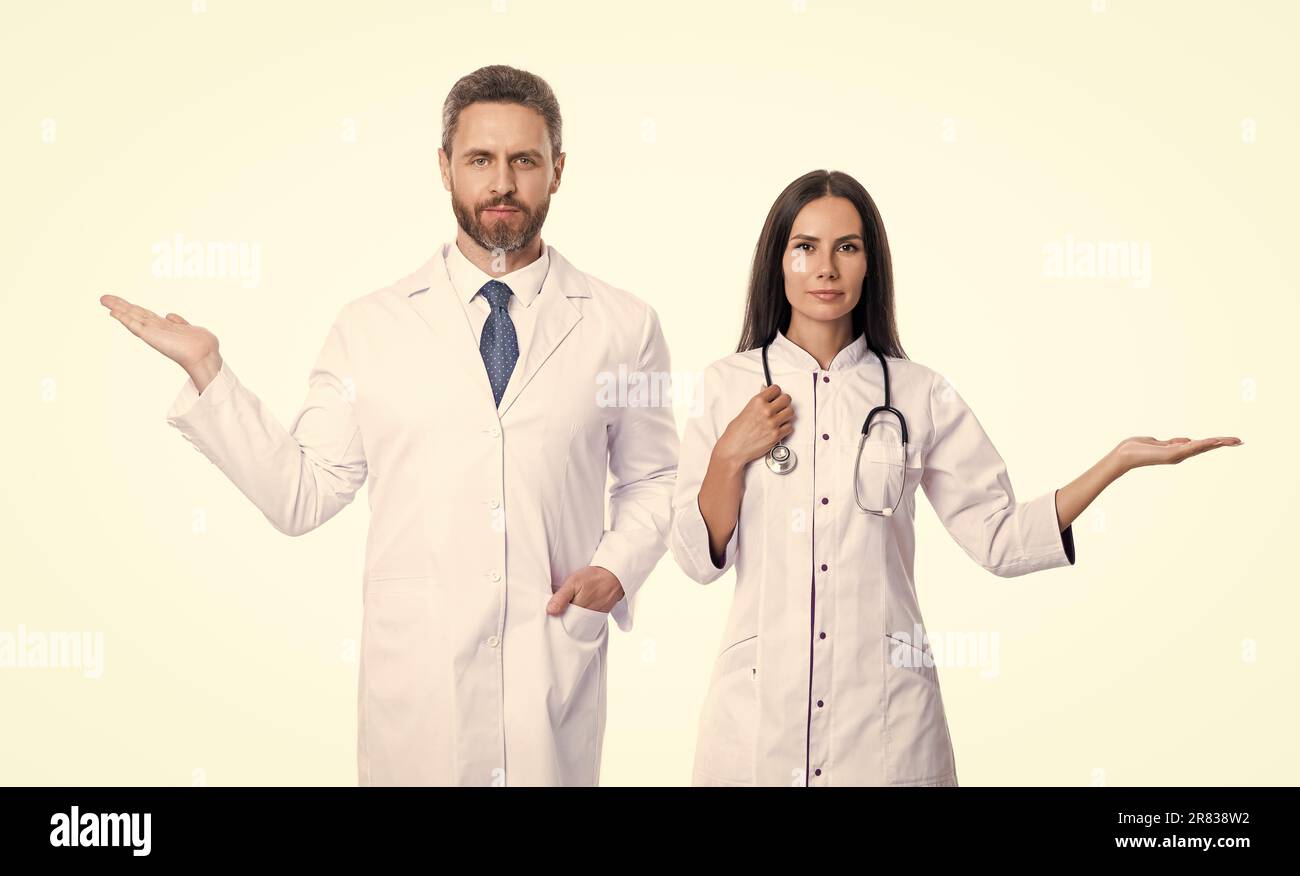 doctor cardiologist and nurse with stethoscope presenting product ...