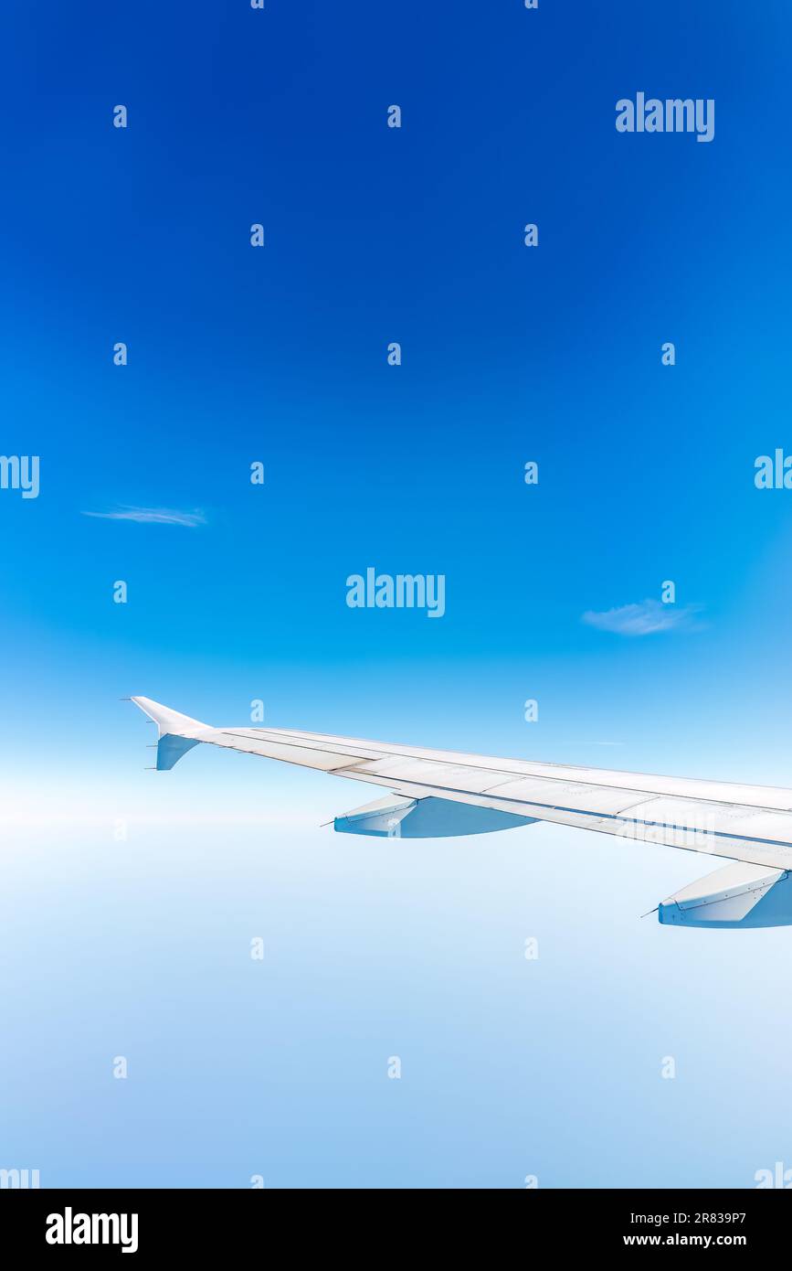 View from the airplane window at a beautiful cloudy sky and the ...