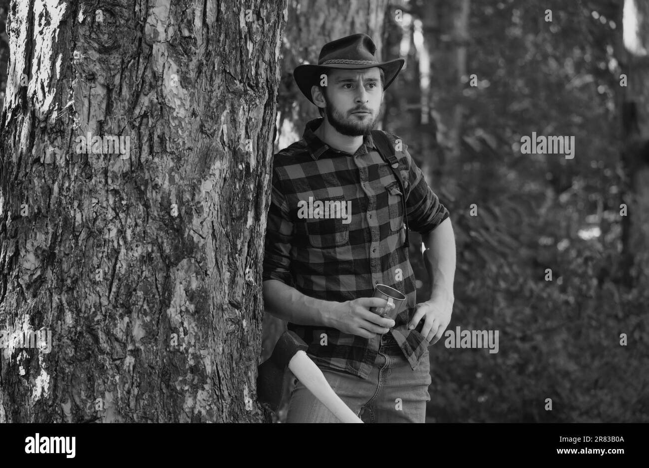 Lumberjack with axe on forest background. Man doing mans job. A ...