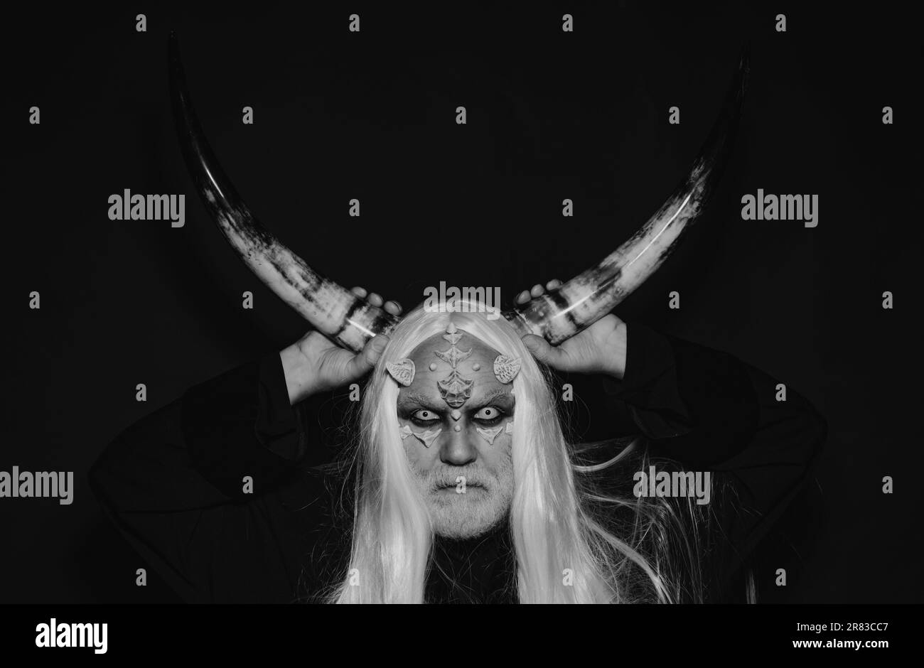 Demon with bloody horns on head. Devil horns. Devil horror concept ...