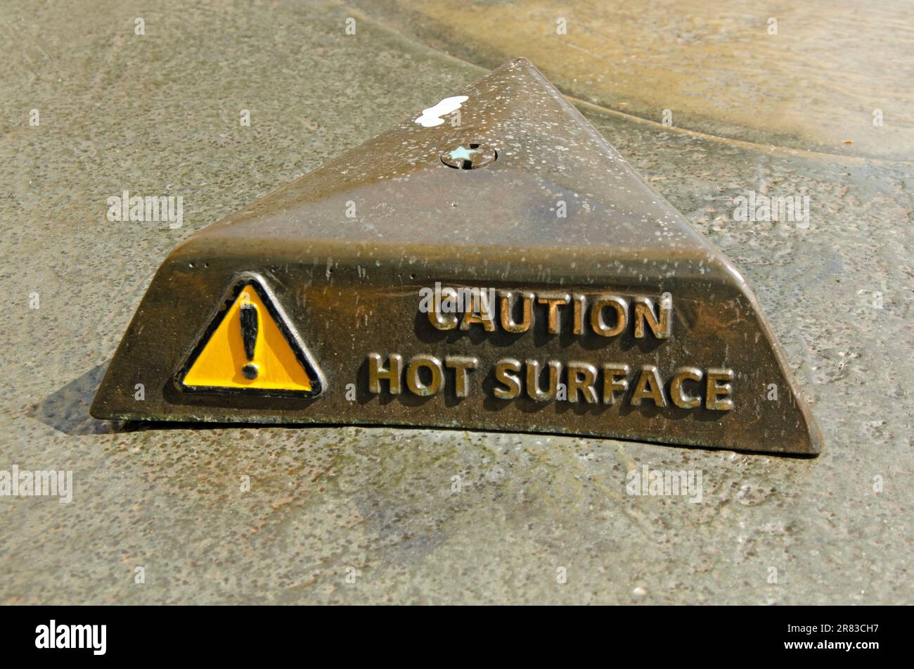 Warning sign of hot surface on granite slab Stock Photo - Alamy