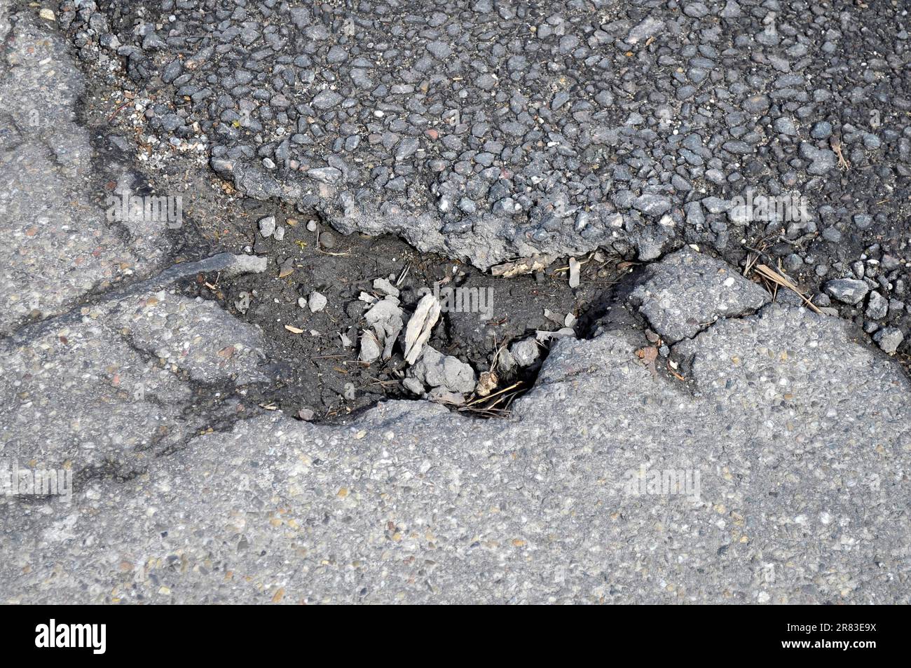 Road damage due to frost, potholes Stock Photo - Alamy