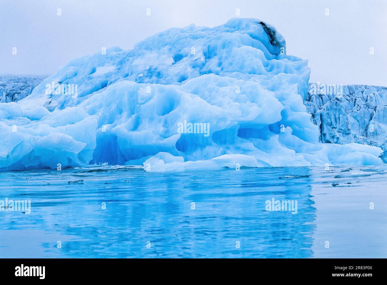 Iceberg floating in the water at a glacier Stock Photo - Alamy