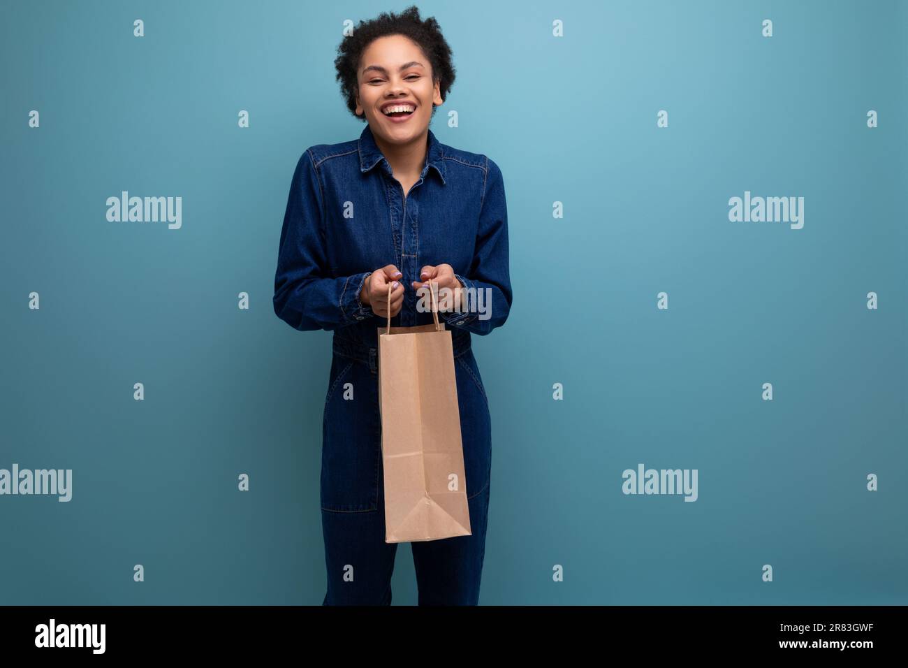 happy positive activist young hispanic brunette woman with fluffy curly ...