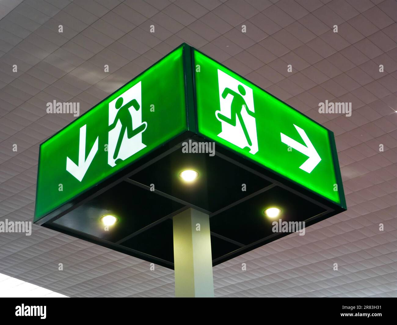 Emergency exit sign, cube light on ceiling, concept Stock Photo - Alamy