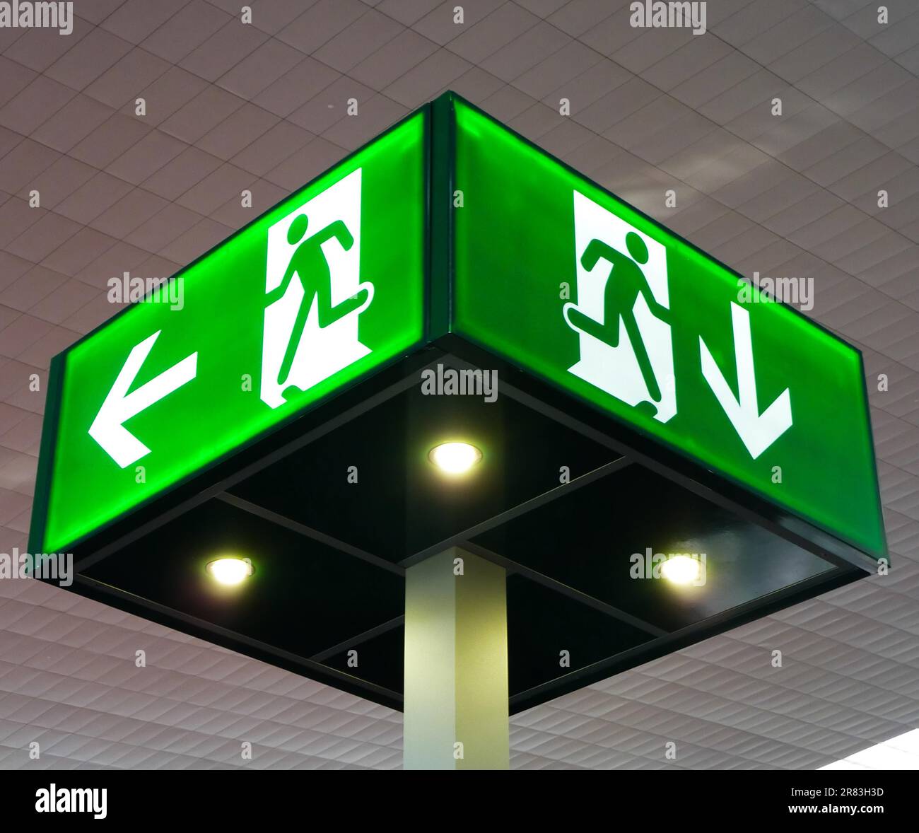 Emergency exit sign, cube light on ceiling, concept Stock Photo - Alamy