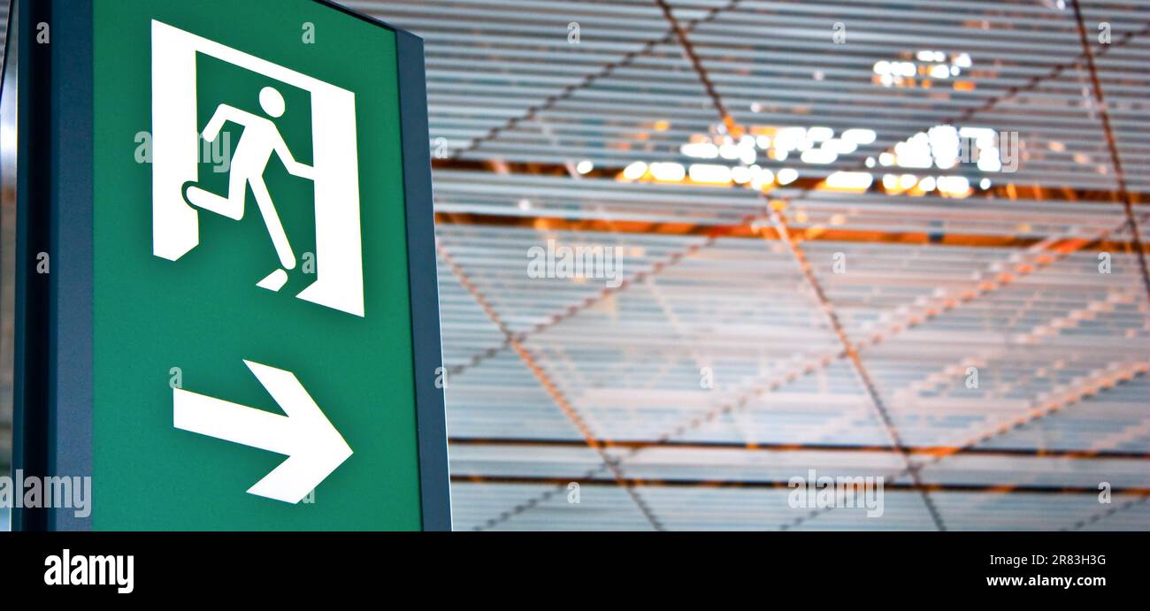 Sign of emergency exit in a Chinese airport, good for conceptual Stock ...