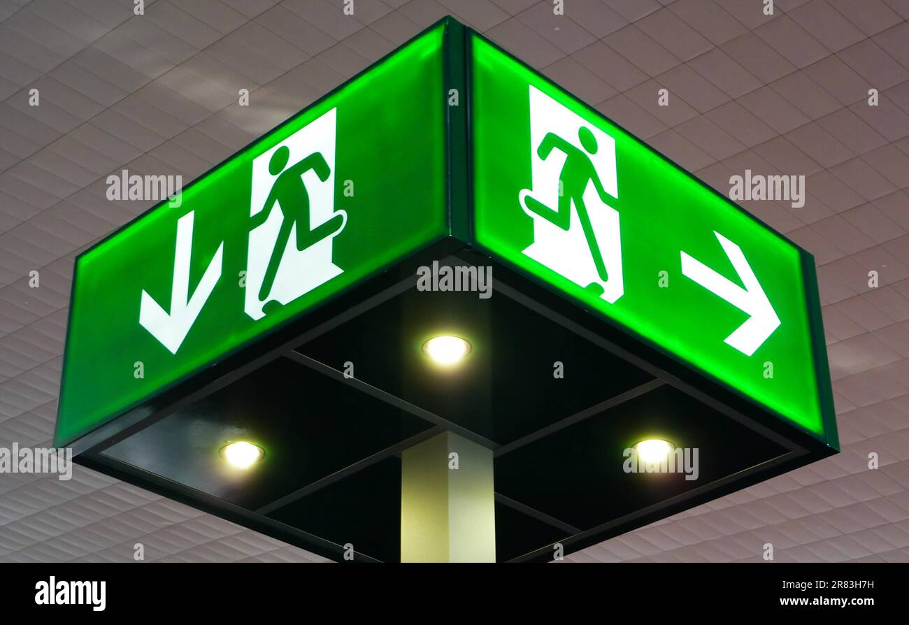 Emergency exit sign, cube light on ceiling, concept Stock Photo - Alamy