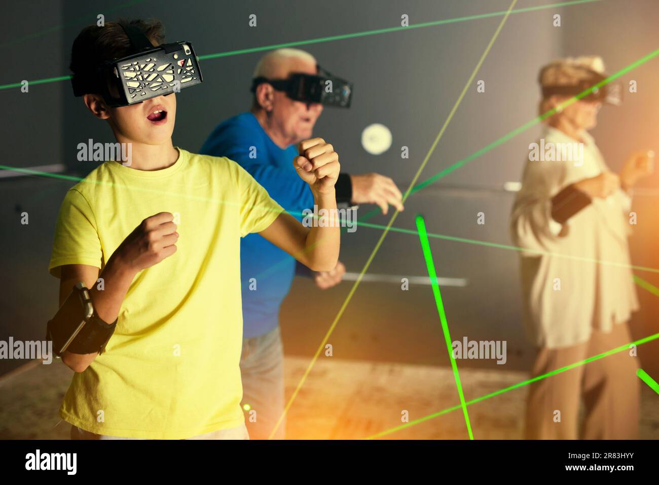 Boy playing VR games with his family Stock Photo - Alamy