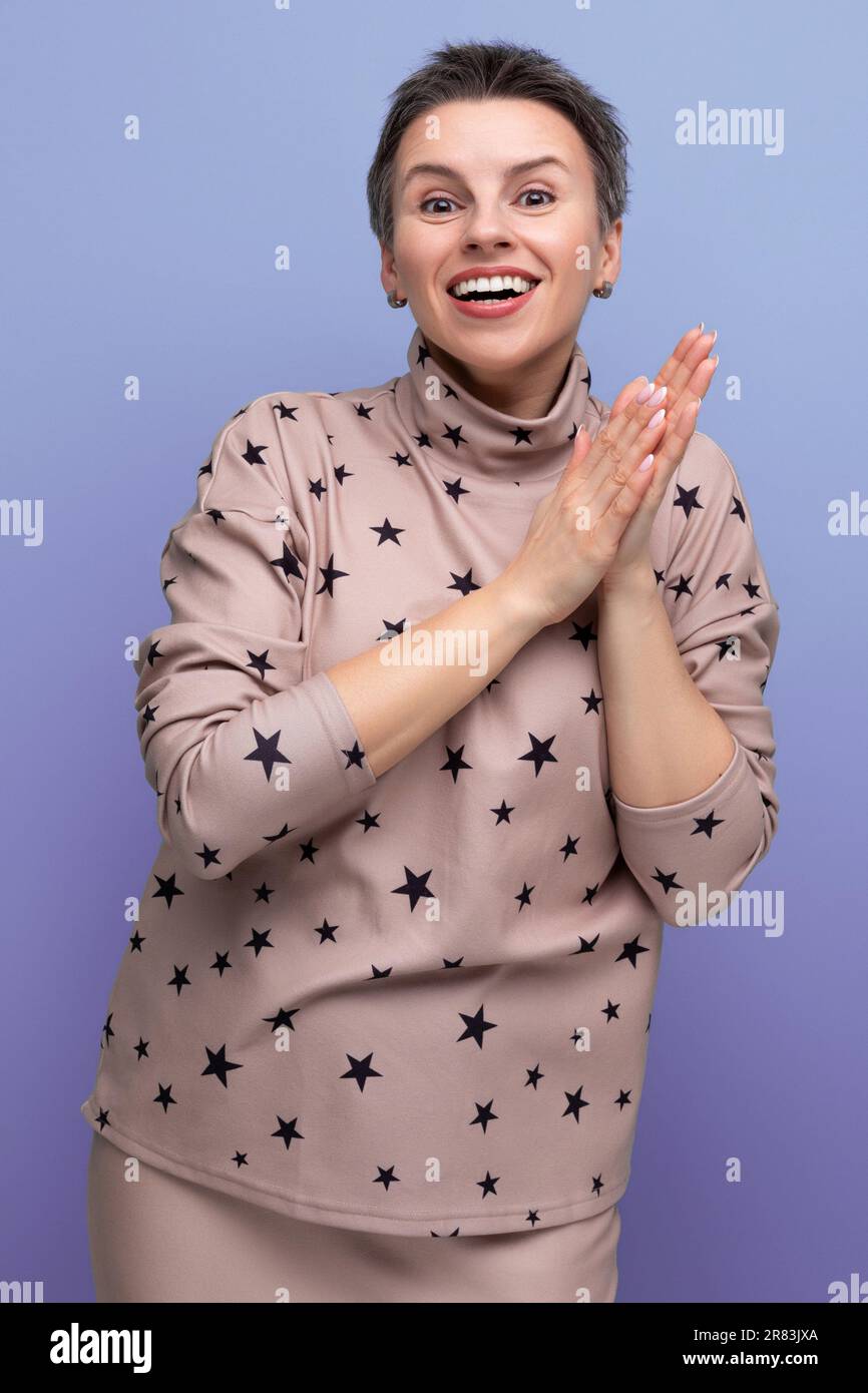 young pretty woman with childlike features with a short haircut is ...