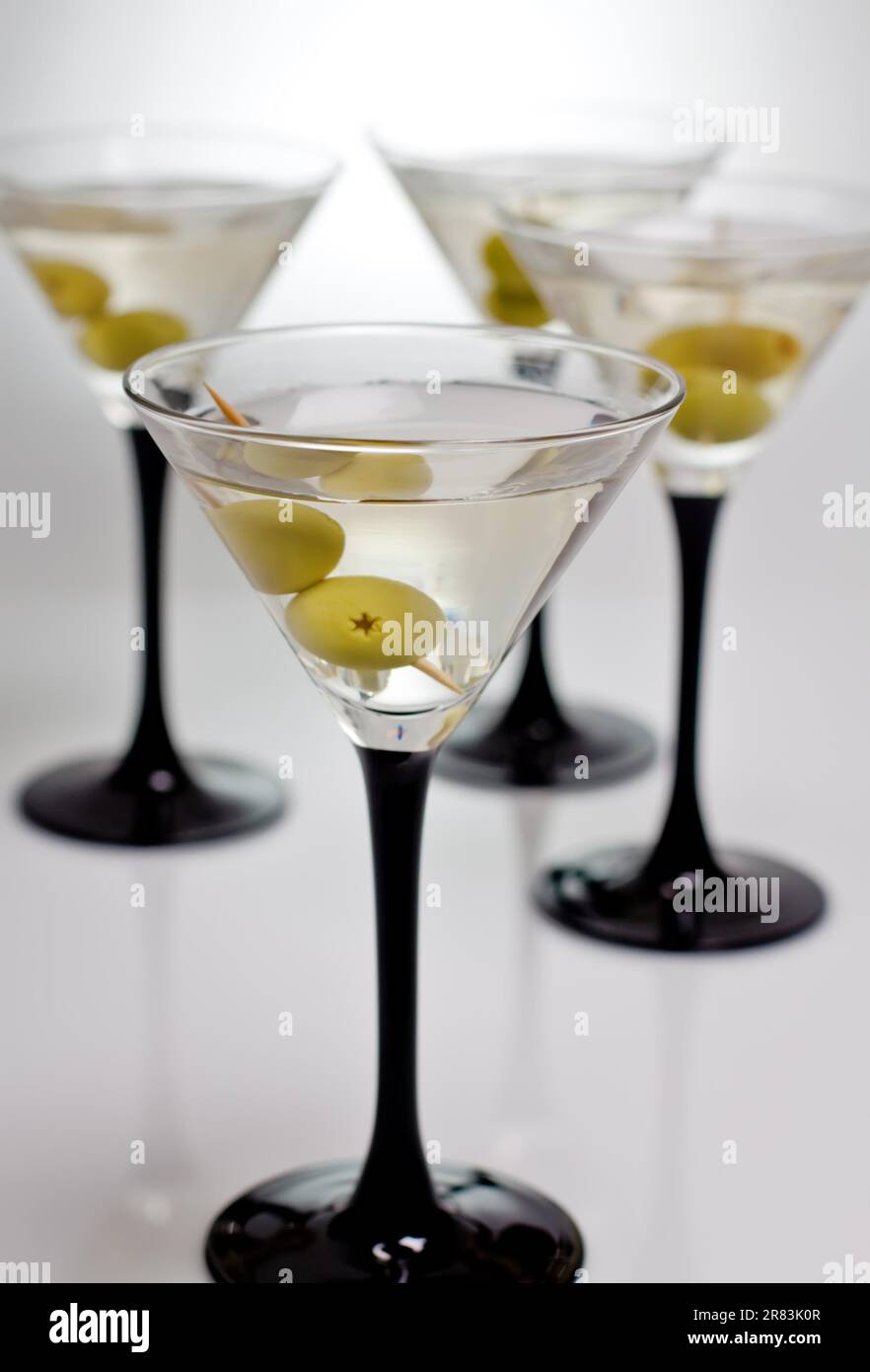 Martini with olives on a white background Stock Photo - Alamy