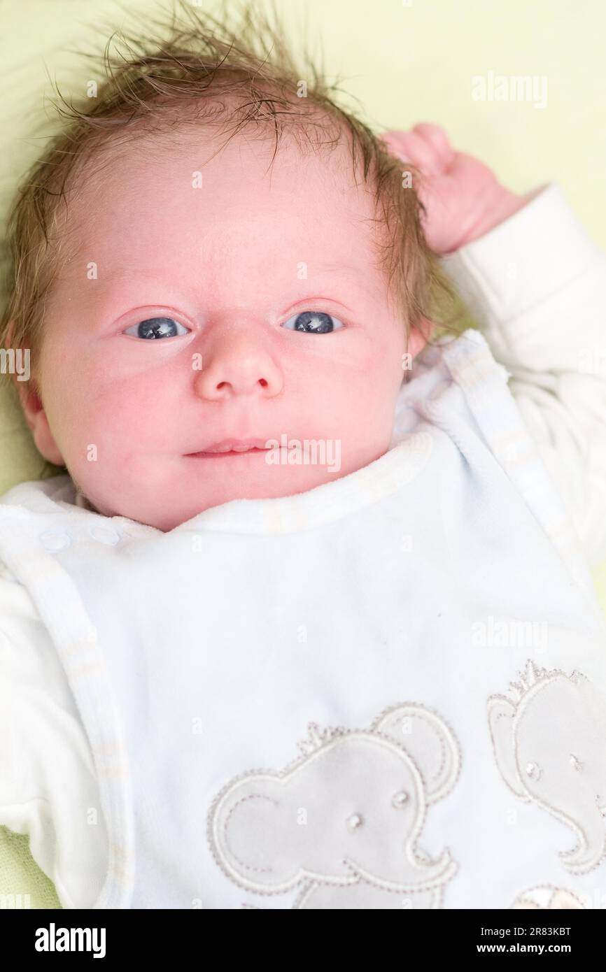 Curious baby looks with wide open eyes Stock Photo - Alamy