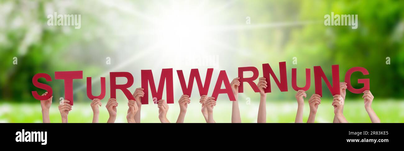 People Hands Building Word Sturmwarnung Means Storm Warning, Grass ...