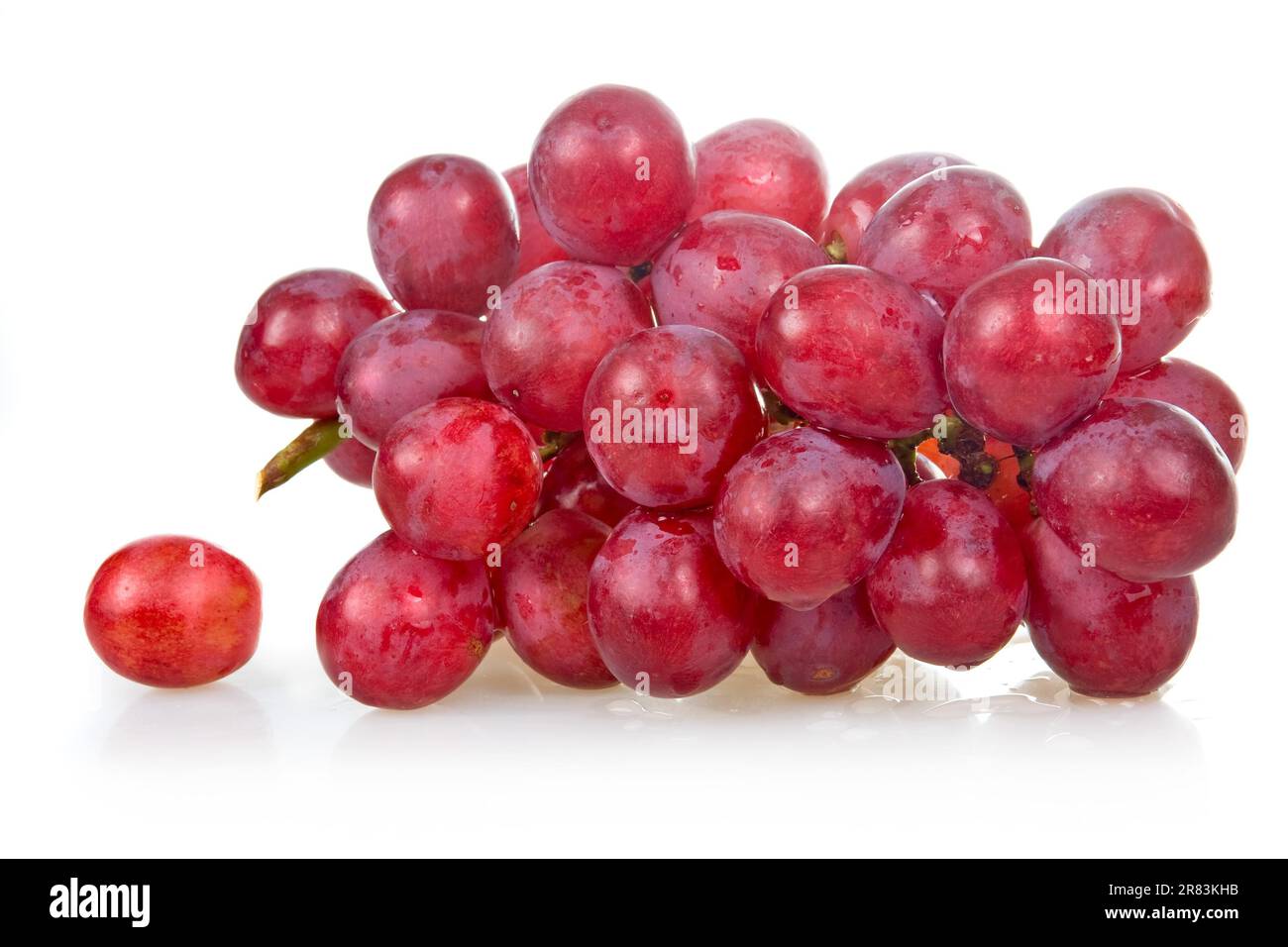 Bunch of ripe pink grapes isolated on white background Stock Photo - Alamy
