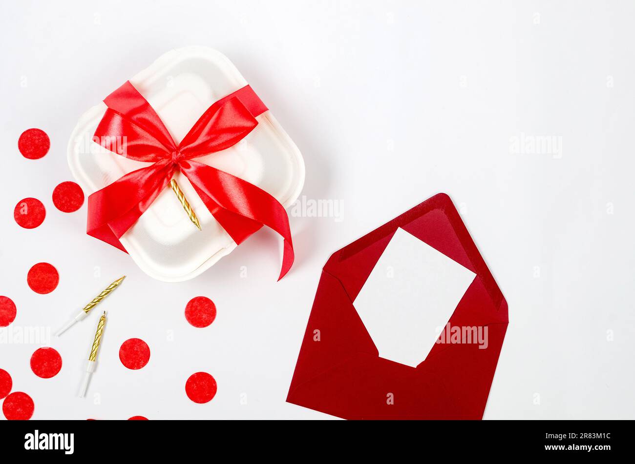 Closed bento cake box with tied red ribbon. Gift box with tasty bento ...