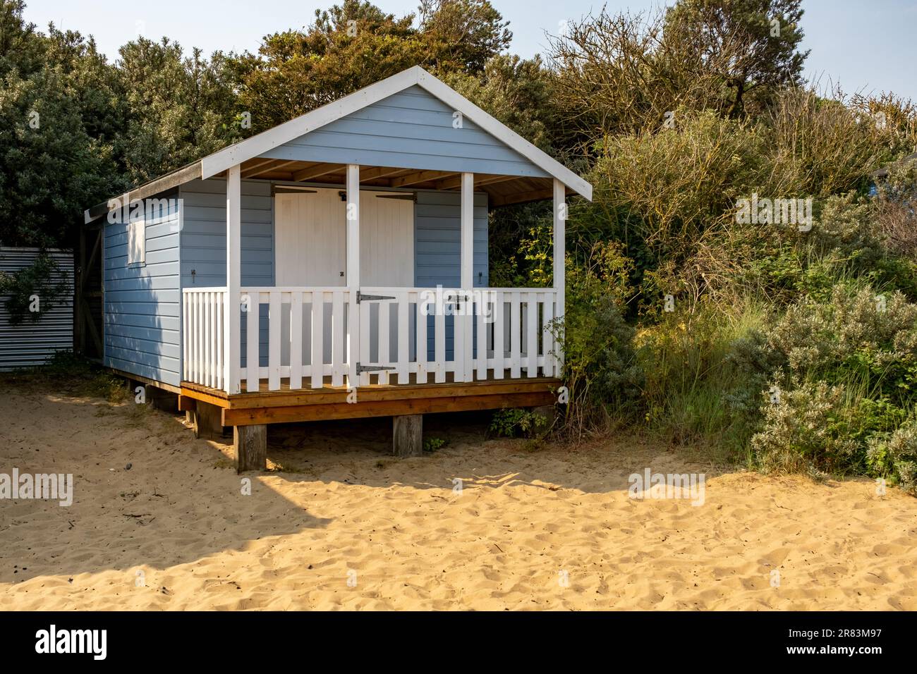 Traditional wooden beach hut in the sand dunes on Hunstanton South ...