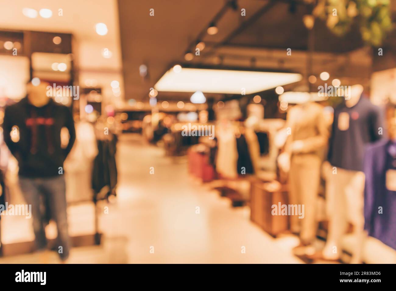 Abstract blur clothing boutique display interior of shopping mall ...