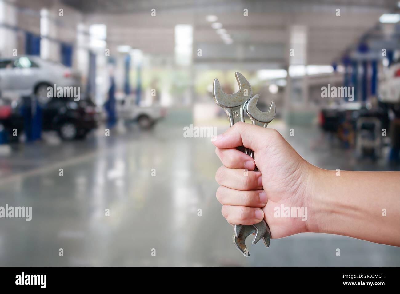 Hand of professional Auto mechanic with wrench, Auto repair service ...