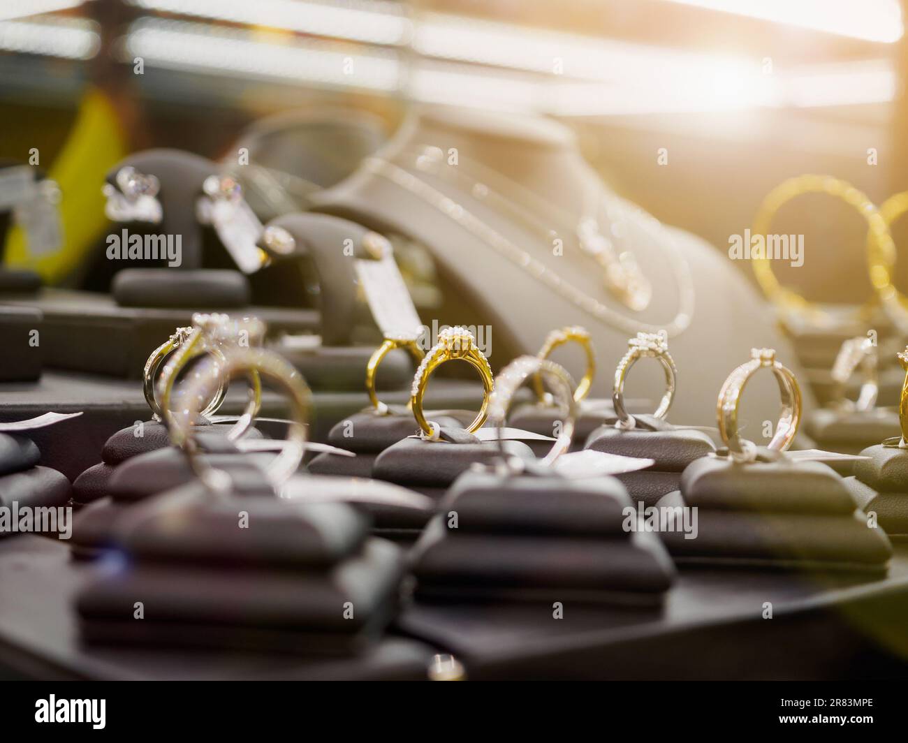 Jewelry diamond rings and necklaces show in luxury retail store window ...