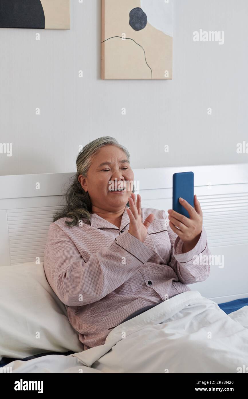 Senior woman in pajamas glasses hi-res stock photography and images - Alamy