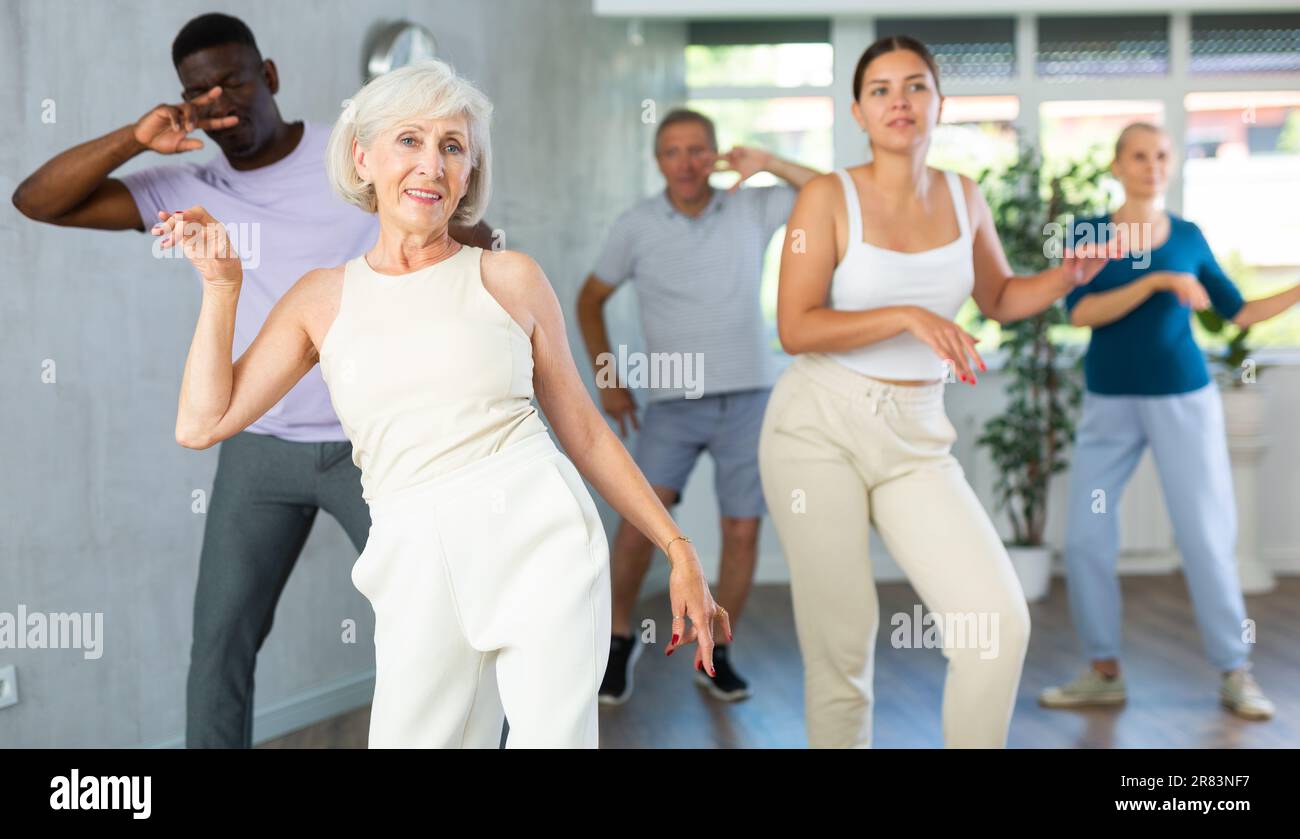 Men and women of different ages practicing Rock 'n' Roll dance in ...