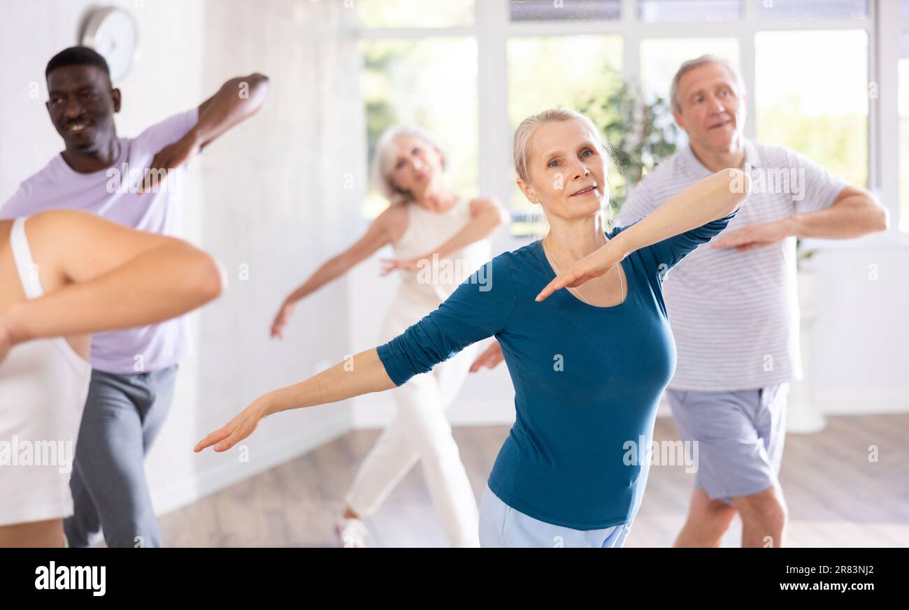 Senior woman dancing hip hop in studio practicing dance number Stock ...