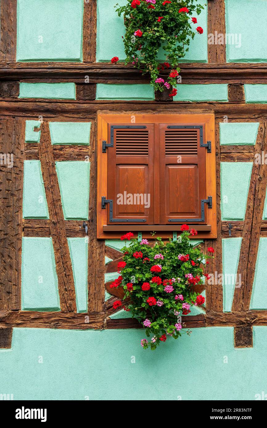 Window decorating with flowers on old timber frame house, France Stock ...