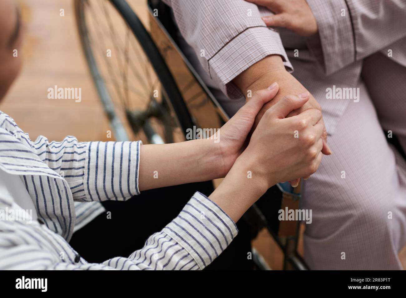 Caregiver holding hand of senior patient to support her Stock Photo - Alamy