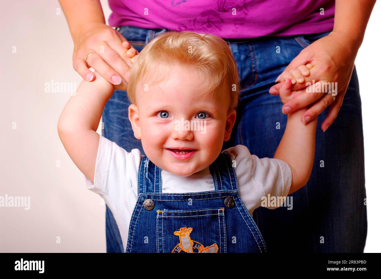 Little boy learns to walk Stock Photo - Alamy