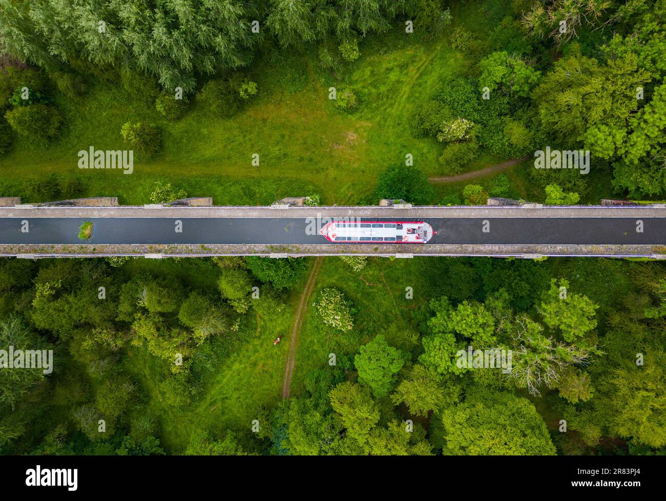 An aerial view of a narrow boat on the Union Canal crossing the River ...