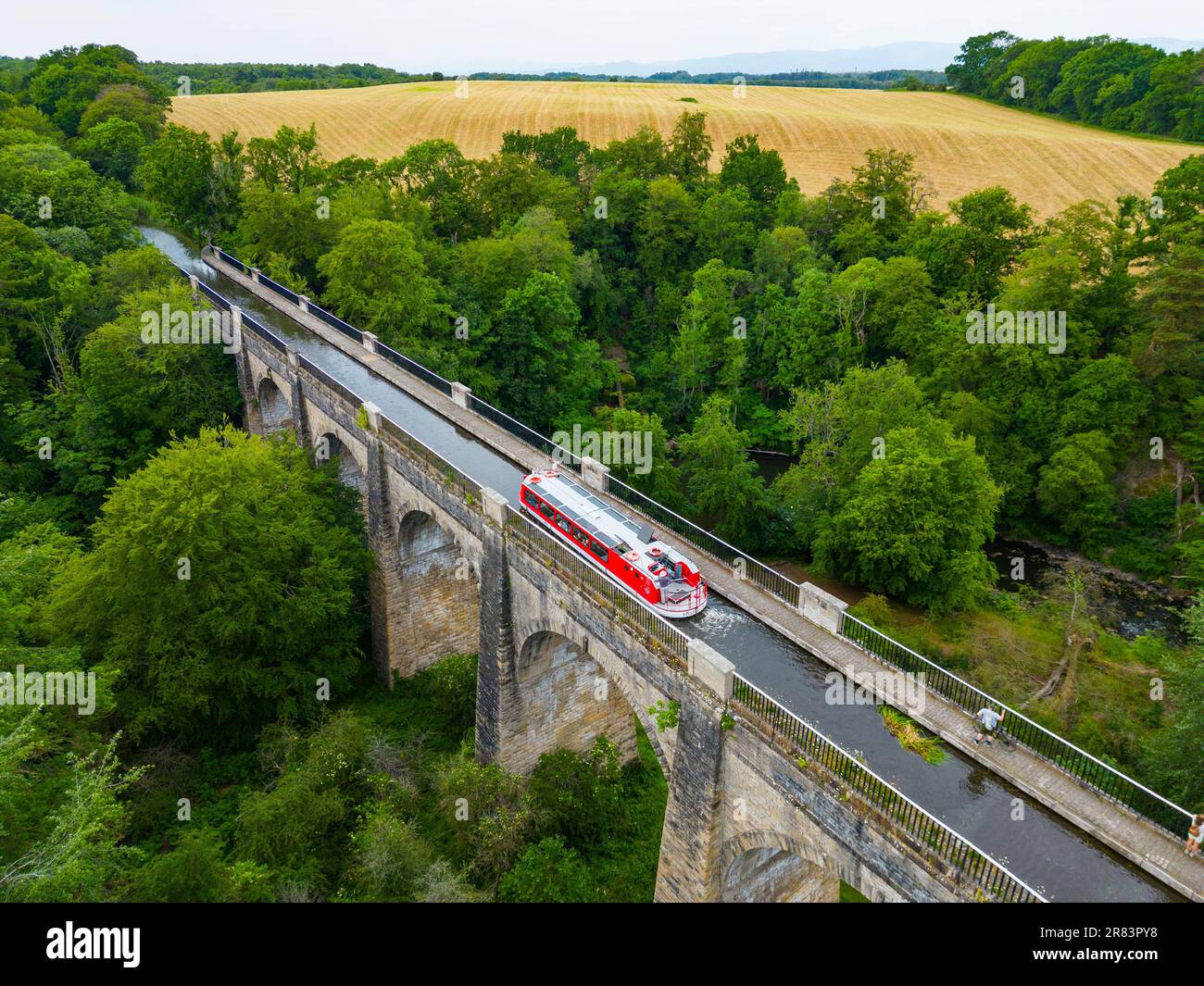 An aerial view of a narrow boat on the Union Canal crossing the River ...