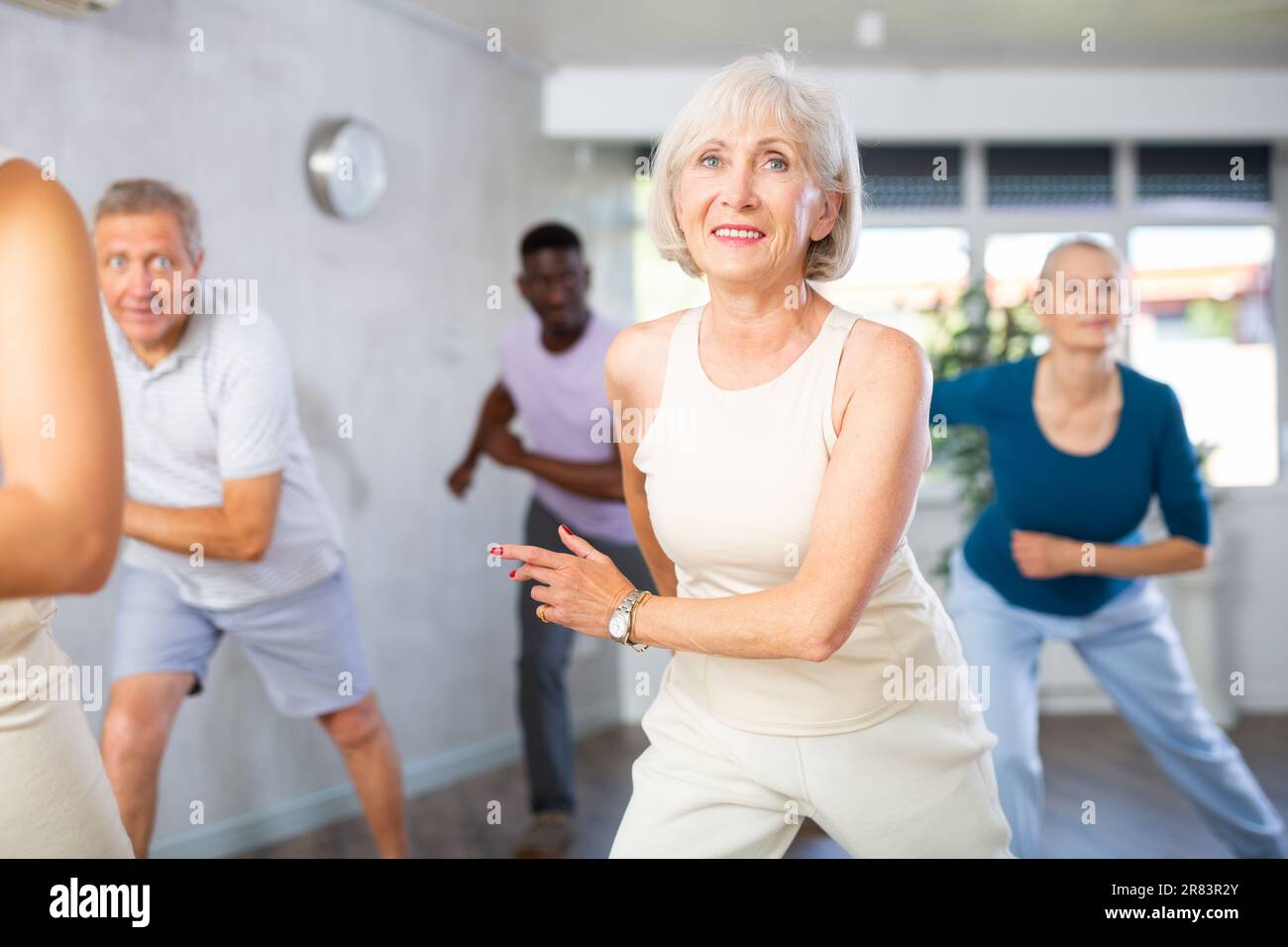 Senior female friends practicing hi-res stock photography and images ...