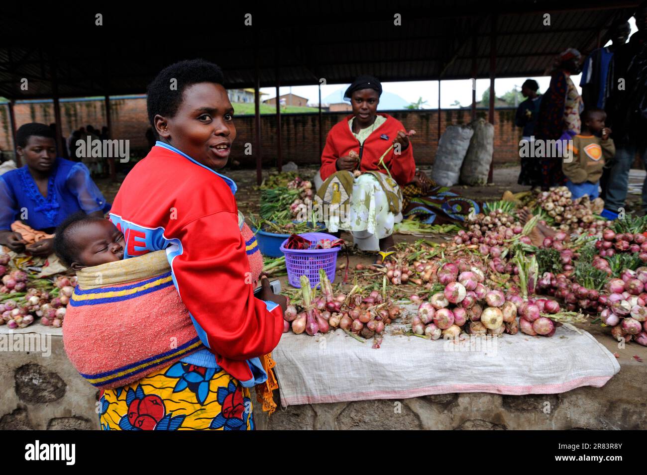 Woman with baby at market, Ruhengeri, Rwanda Stock Photo - Alamy