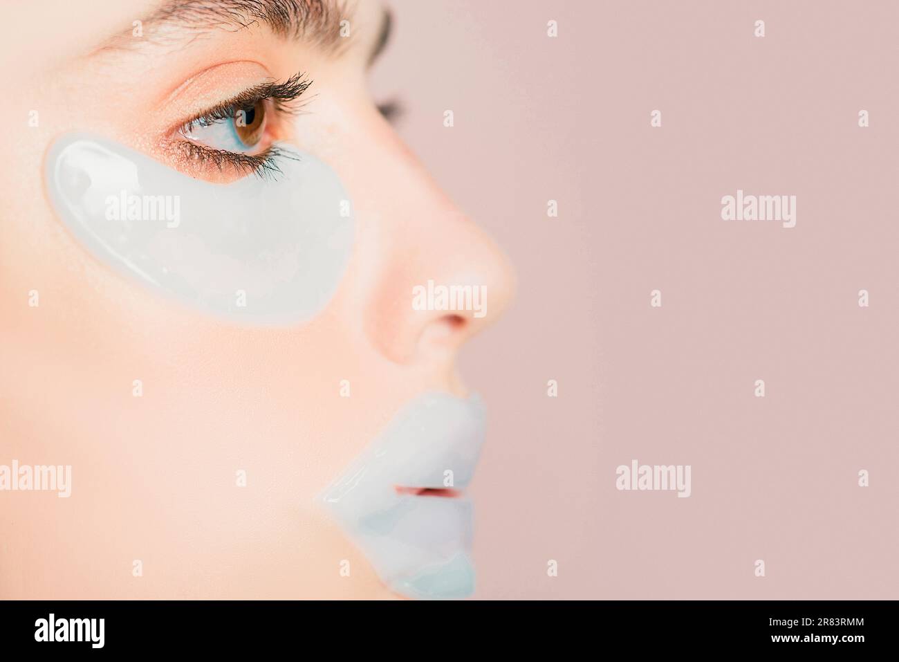 Close up woman face with flakes under the eyes. Patches under close ...