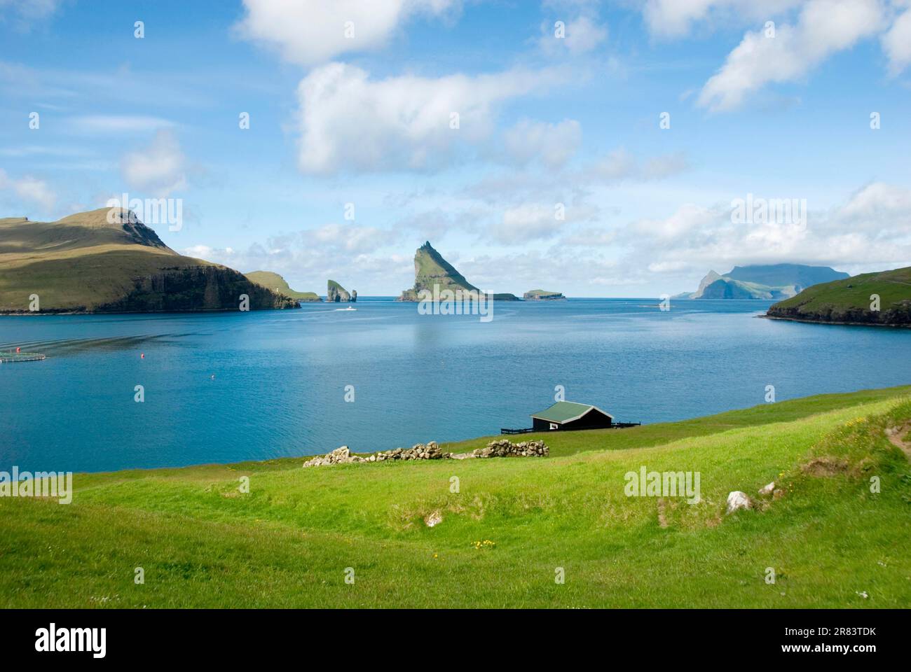 Coast near Bour, Sorvagsfjoerdur, view of islands Tindholmur and ...