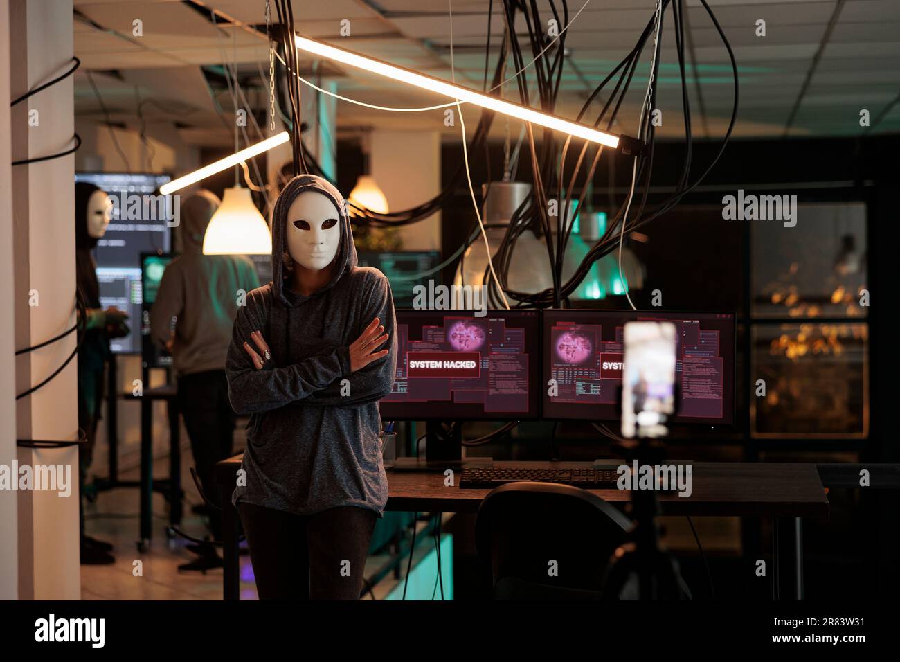 Online hacker filming live ransomware video on smartphone, threatening ...