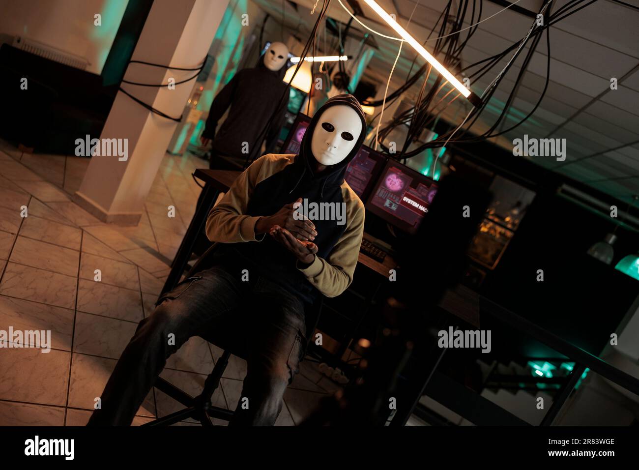 Criminal with anonymous mask threatening to expose government data on live broadcast, asking for ...