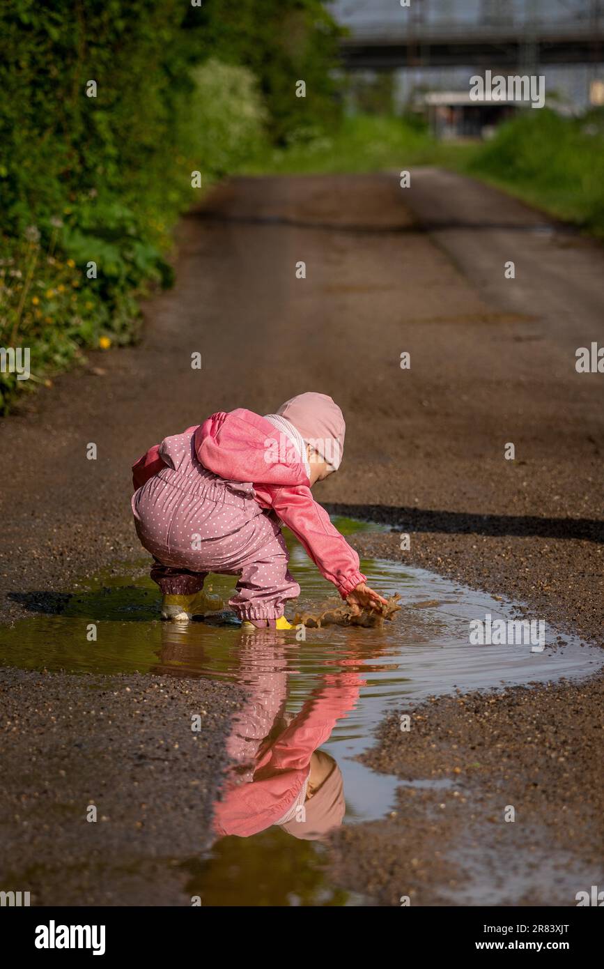 Child puddle hi-res stock photography and images - Alamy