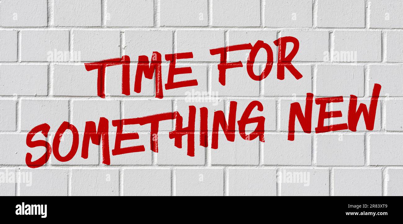 Graffiti on a brick wall - Time for something new Stock Photo - Alamy