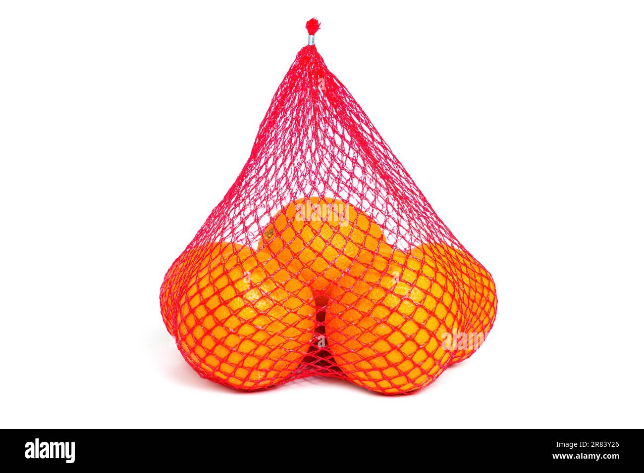 Bunch of fresh and juicy oranges in a red mesh bag isolated on white ...