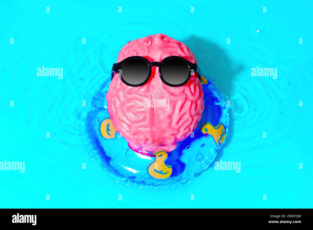 Cute character, made from a human brain model wearing sunglasses ...