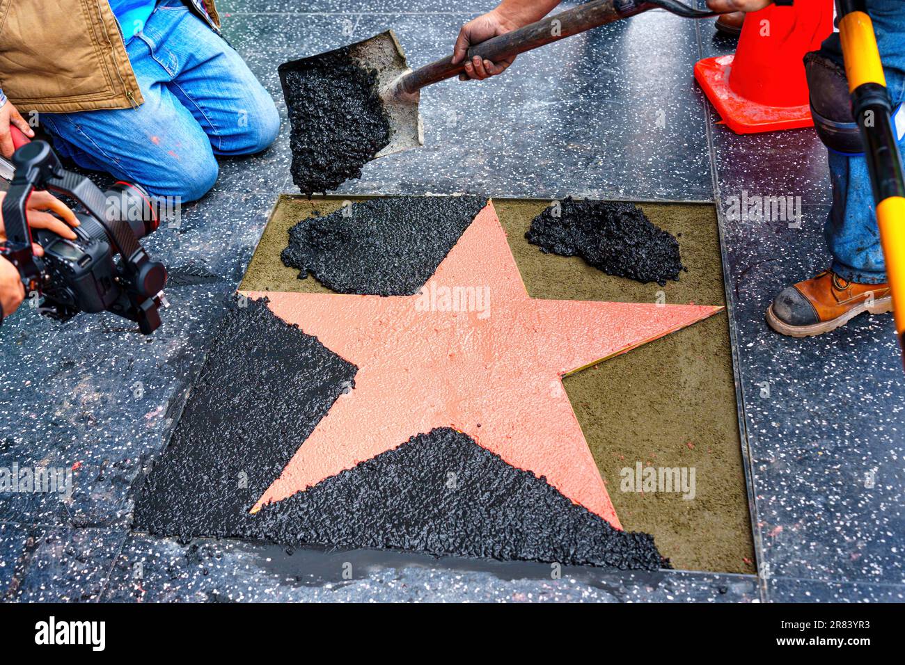 The process of placing terrazzo pavement around a coral star on the ...